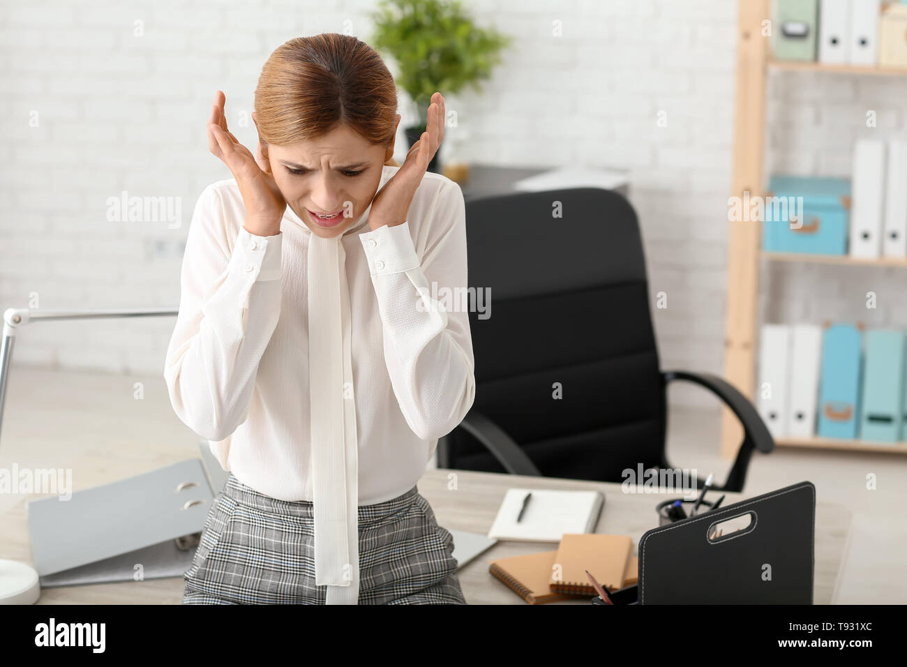 Woman having panic attack at workplace Stock Photo - Alamy