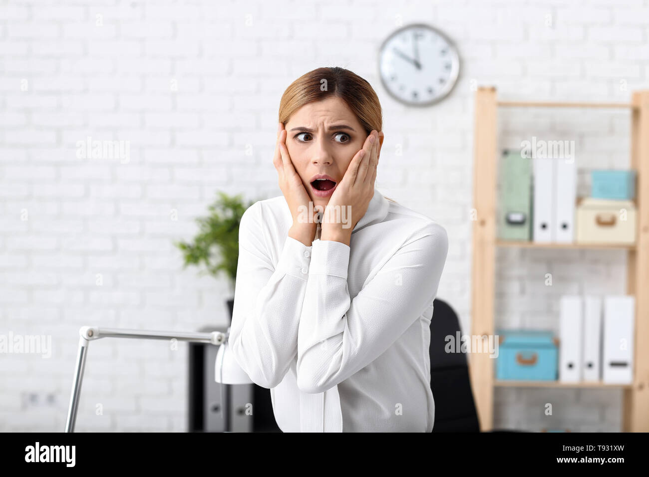 Woman having panic attack at workplace Stock Photo - Alamy