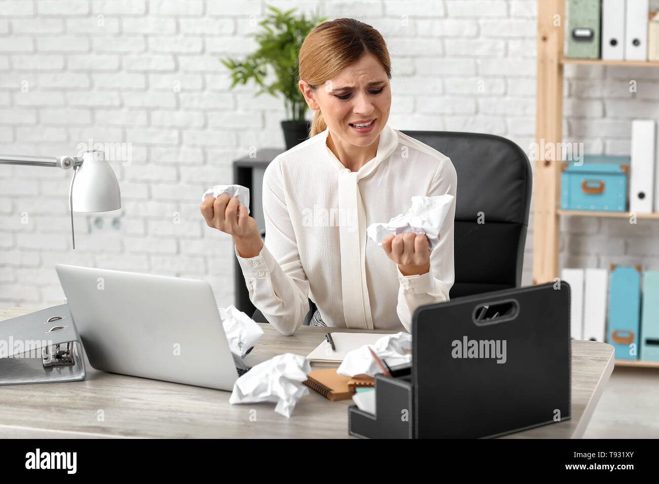Woman crumpling paper hi-res stock photography and images - Alamy