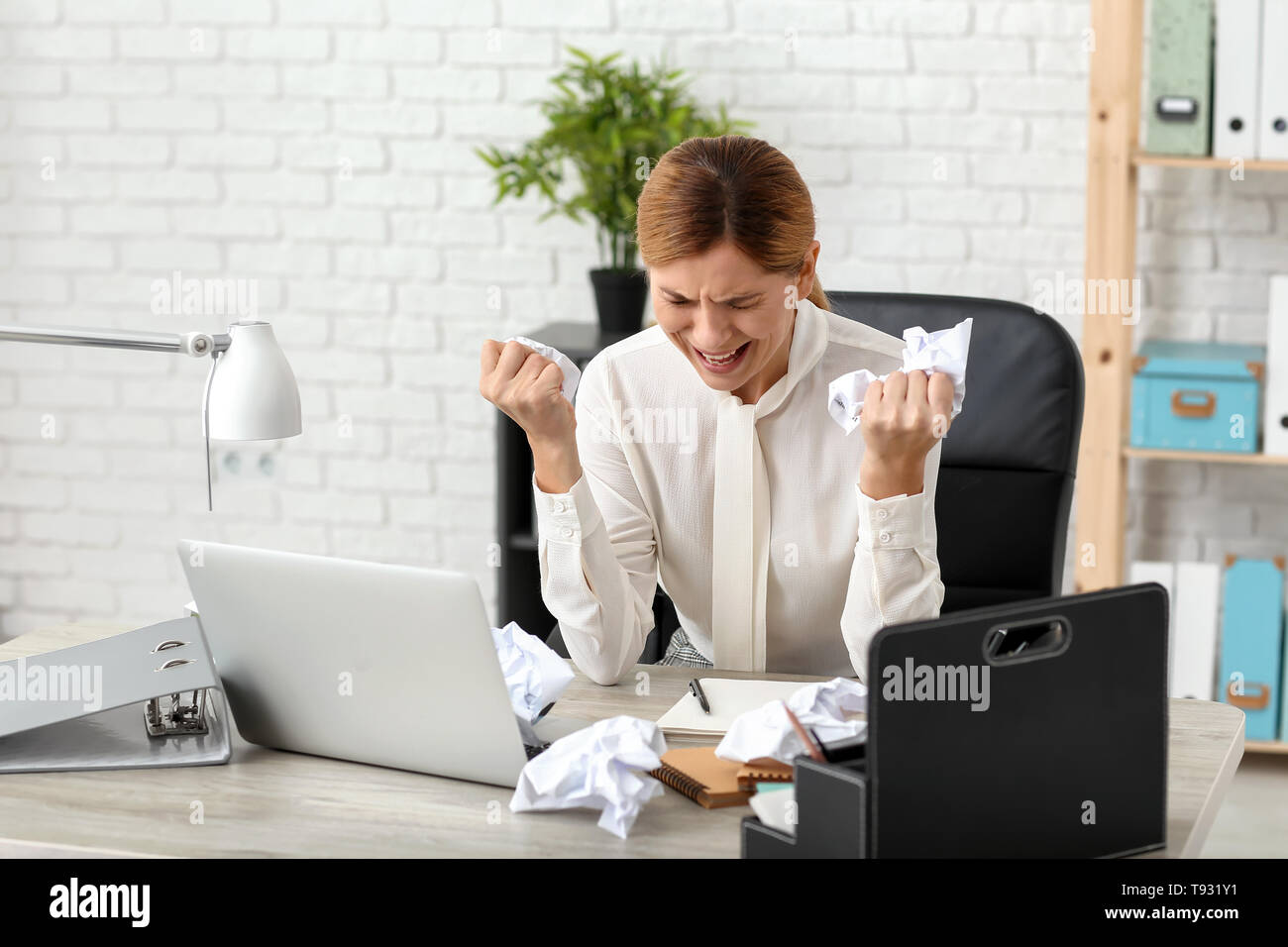 Woman crumpling paper hi-res stock photography and images - Alamy