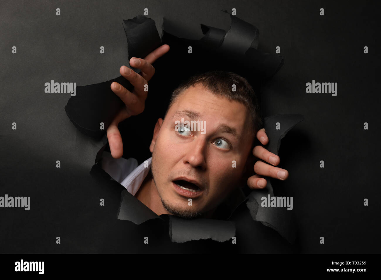 Tearing man paper hi-res stock photography and images - Alamy
