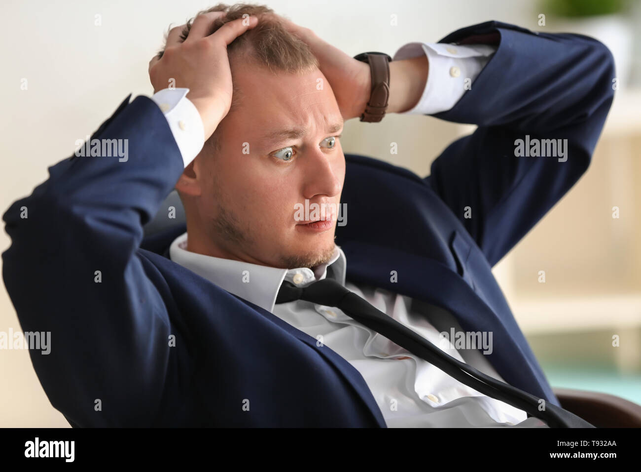 Man having panic attack at workplace in office Stock Photo - Alamy