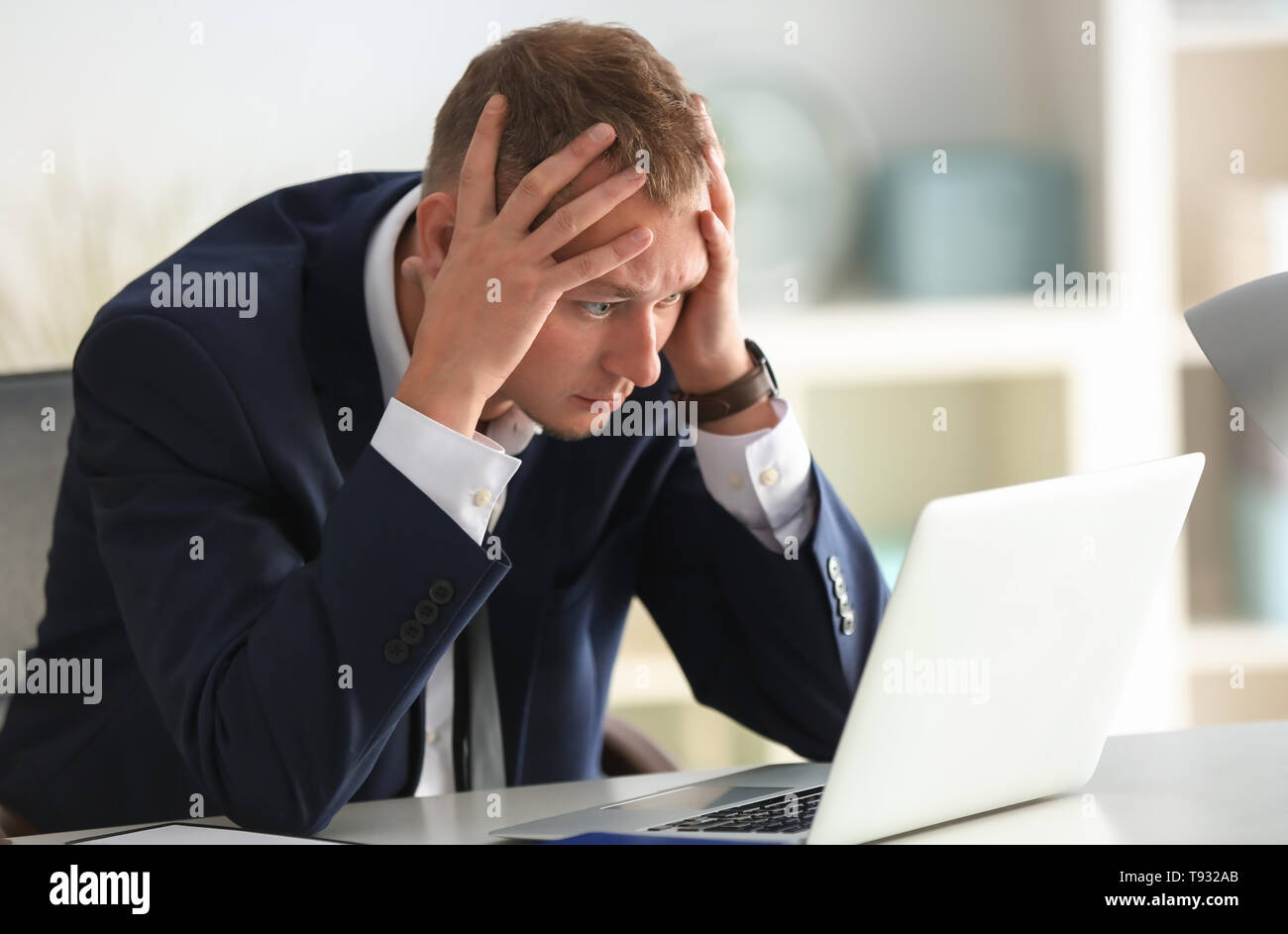 Man having panic attack at workplace in office Stock Photo - Alamy