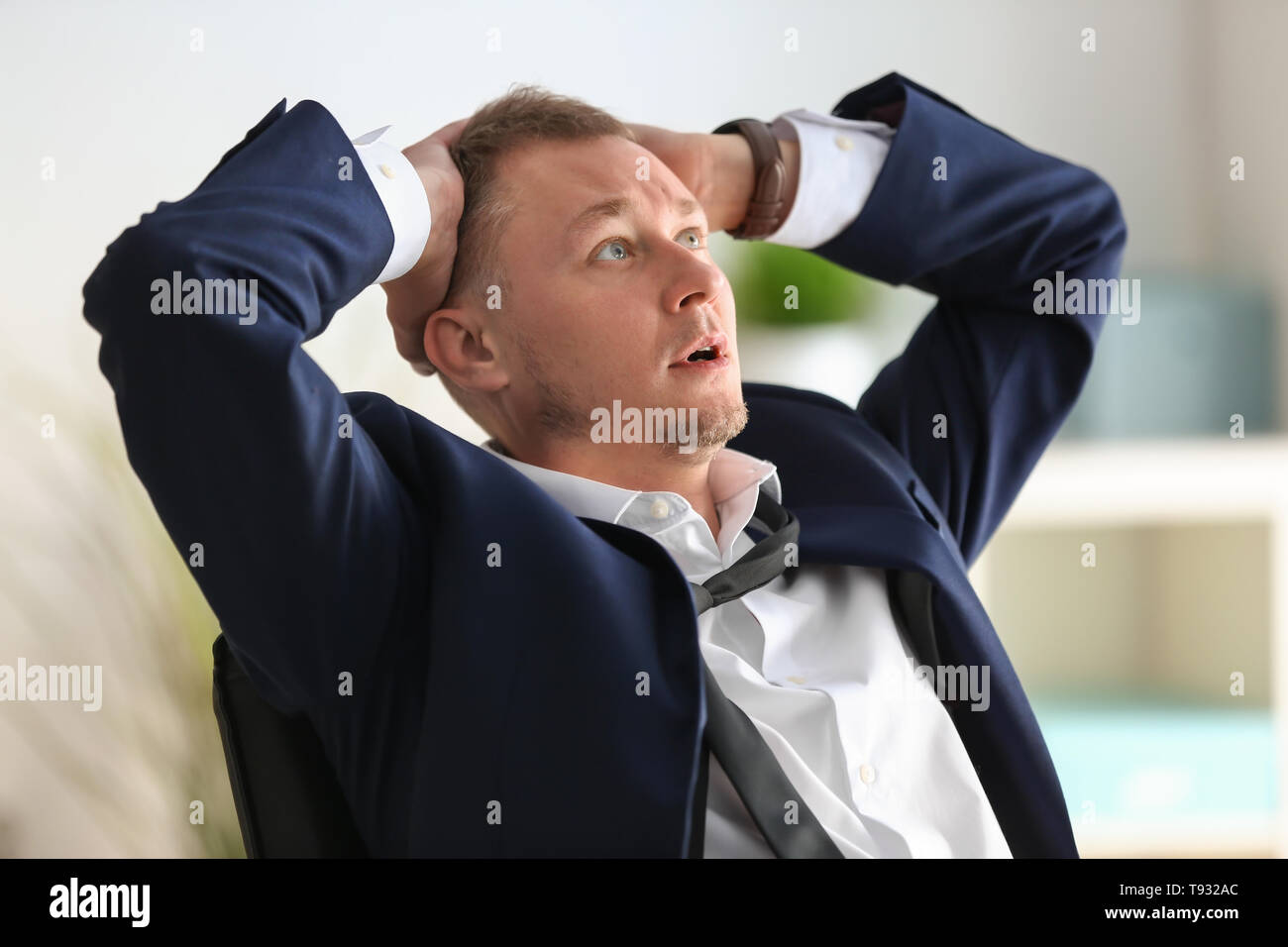 Man having panic attack at workplace in office Stock Photo - Alamy