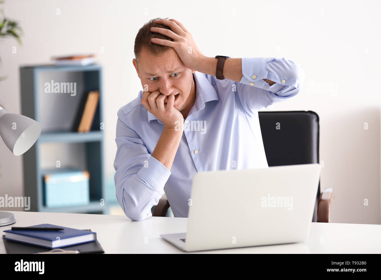 Man having panic attack at workplace in office Stock Photo - Alamy