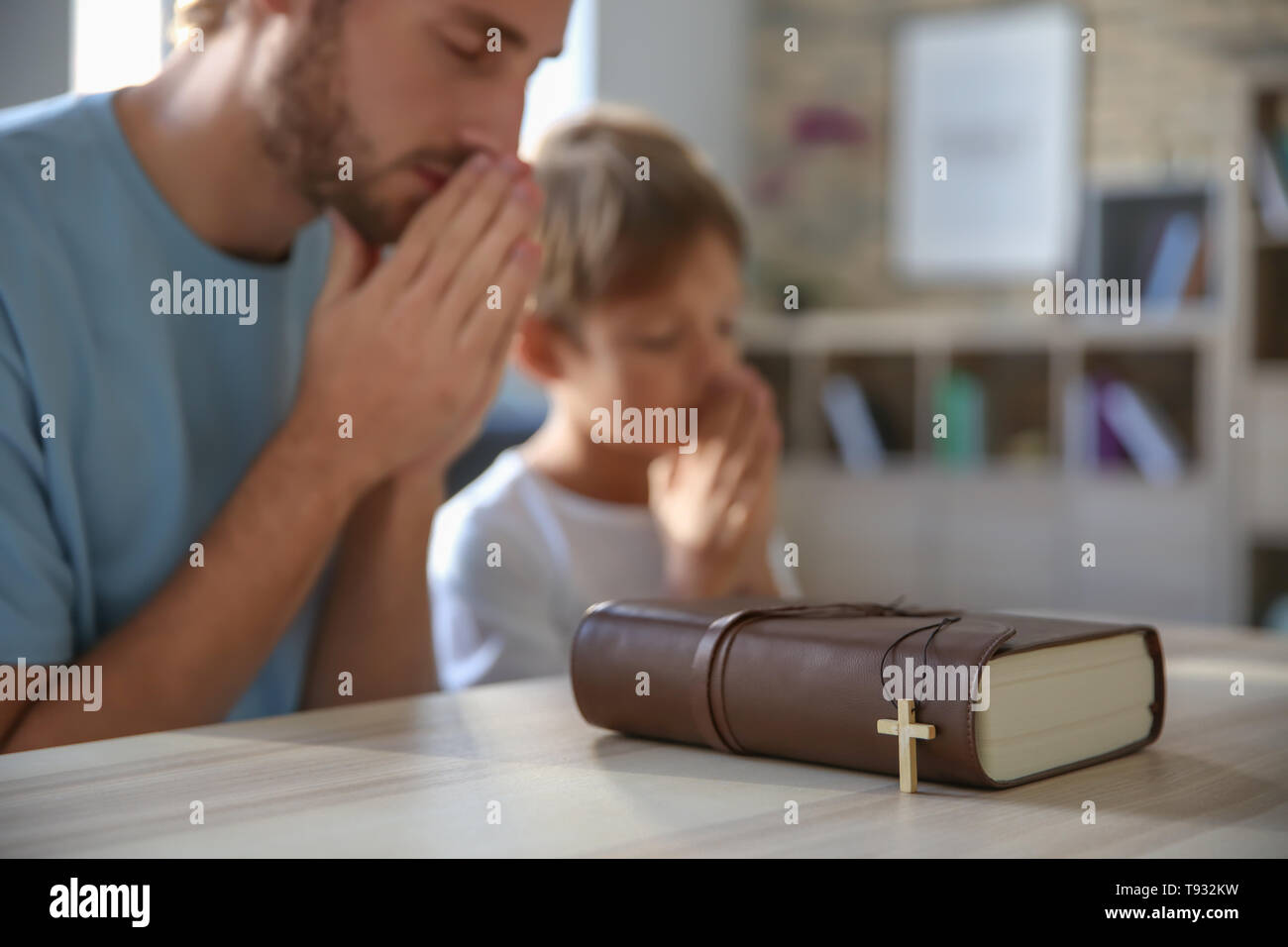 Father with son praying at home Stock Photo - Alamy