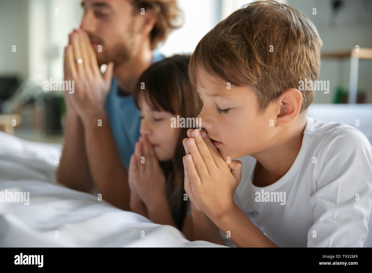 Child praying bed hi-res stock photography and images - Alamy