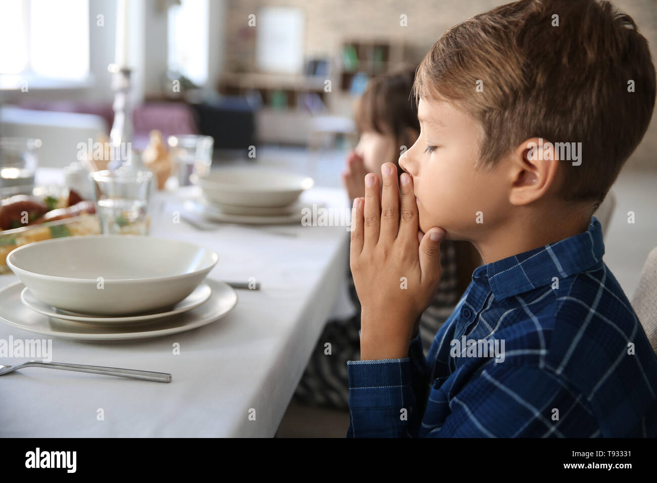 Little boy praying before meal at home Stock Photo - Alamy
