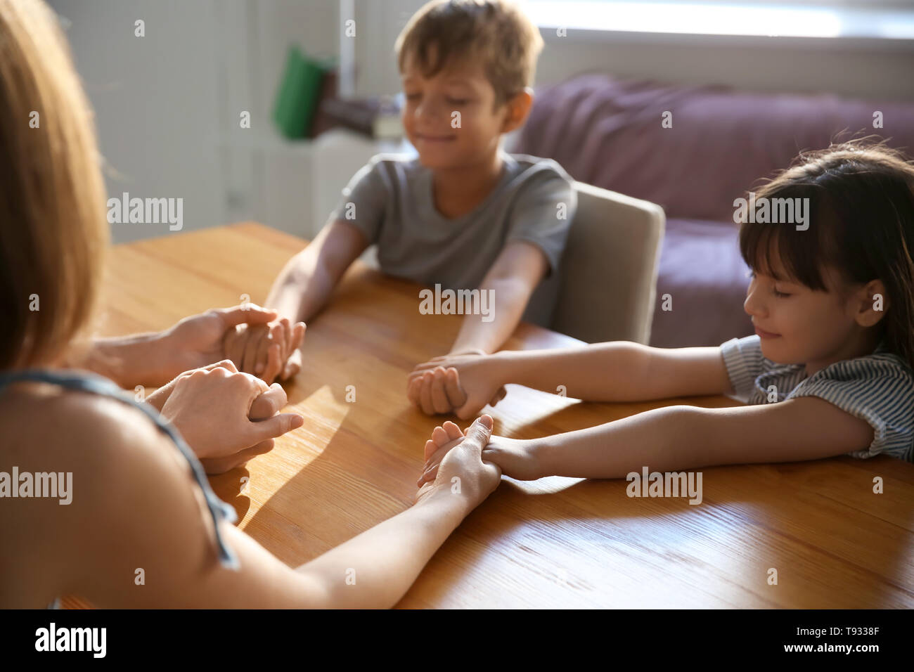 Family praying at home Stock Photo - Alamy