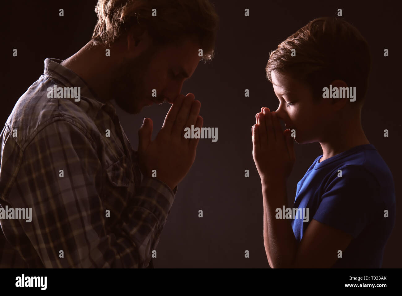 Praying father hi-res stock photography and images - Alamy