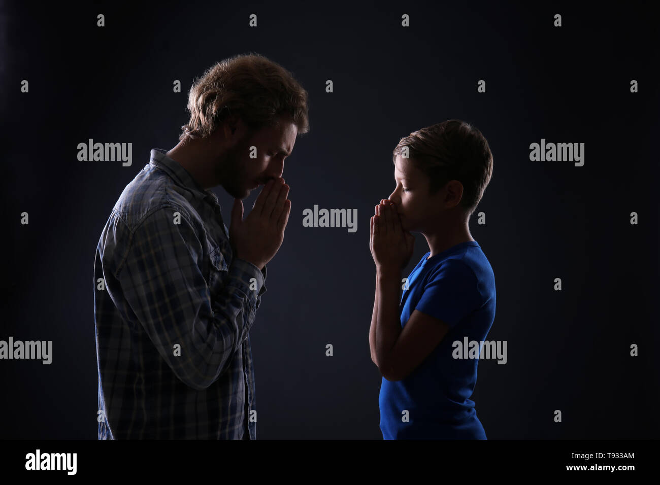Praying father hi-res stock photography and images - Alamy
