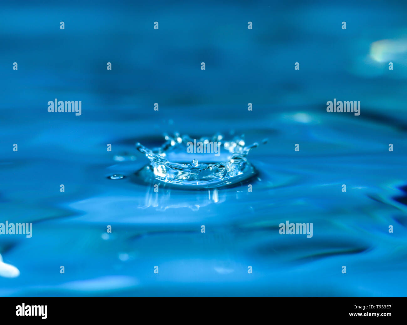 Splash after falling of water drop, closeup Stock Photo - Alamy