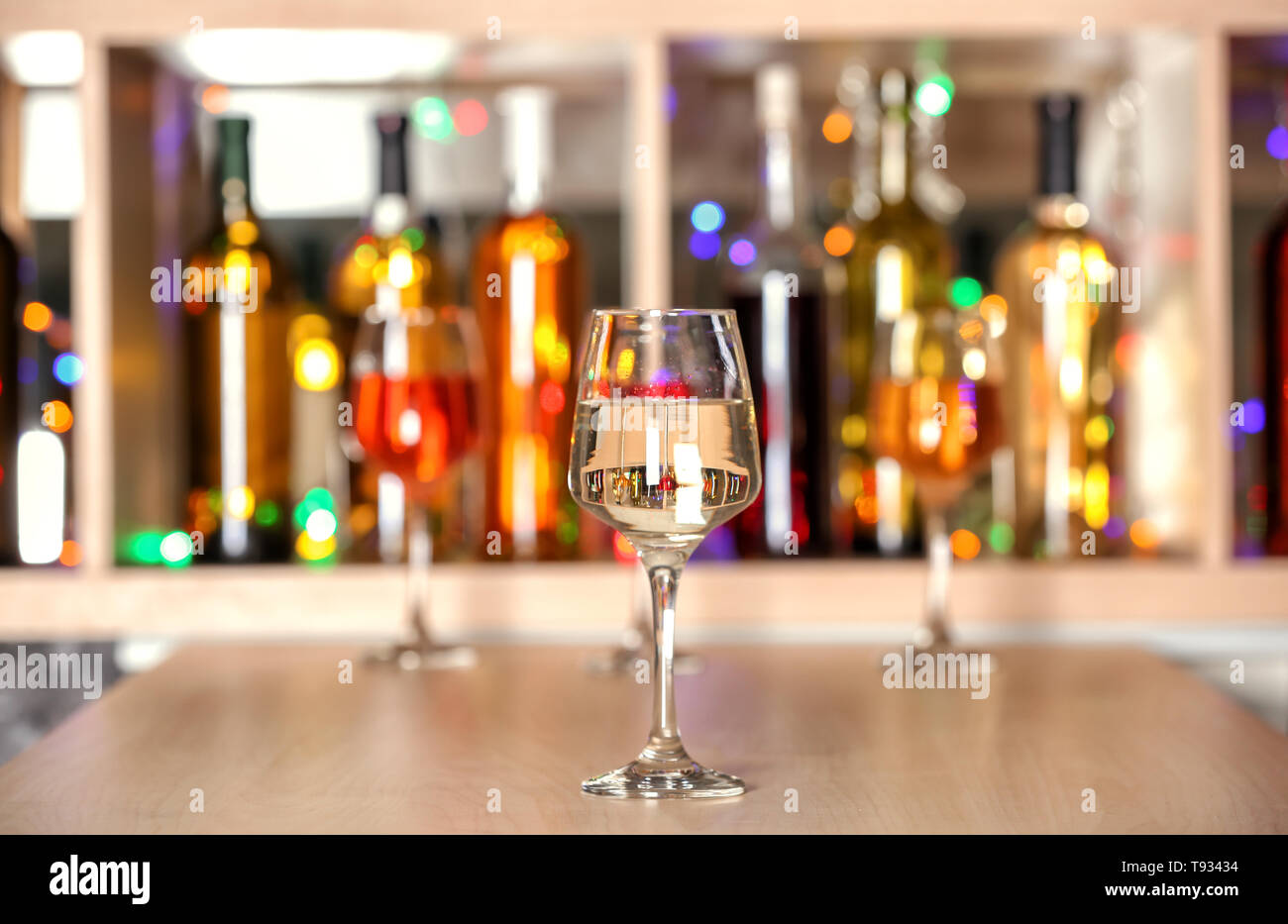 Glass of tasty wine on bar counter Stock Photo - Alamy