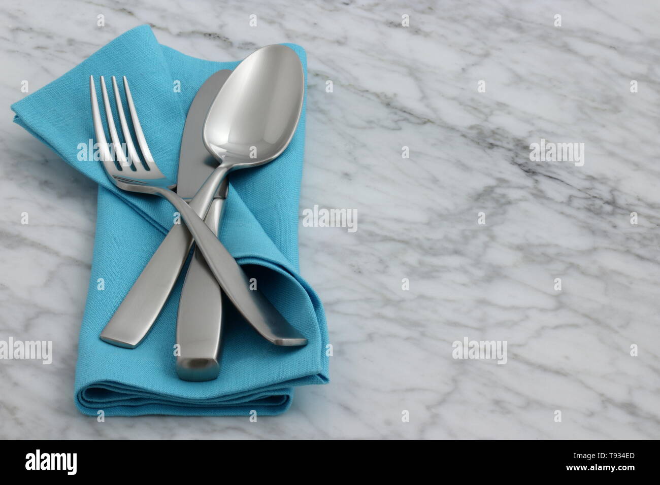 trendy and beautiful silverware set styled on linen double hemstitch ...