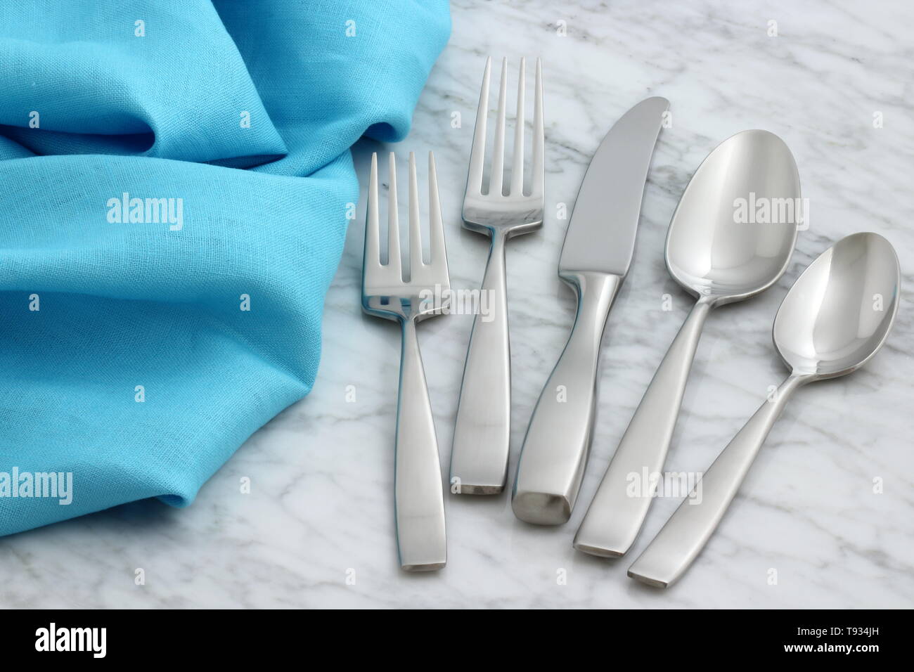 trendy and beautiful silverware set styled on linen double hemstitch ...