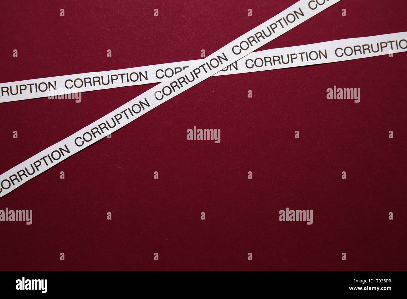 Strips of paper with words CORRUPTION on red background Stock Photo - Alamy