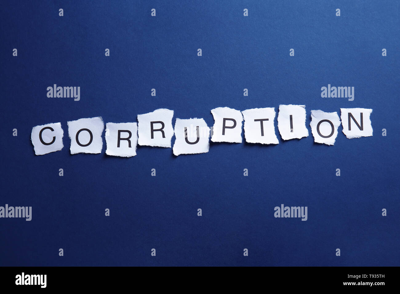 Torn pieces of paper with word CORRUPTION on blue background Stock ...