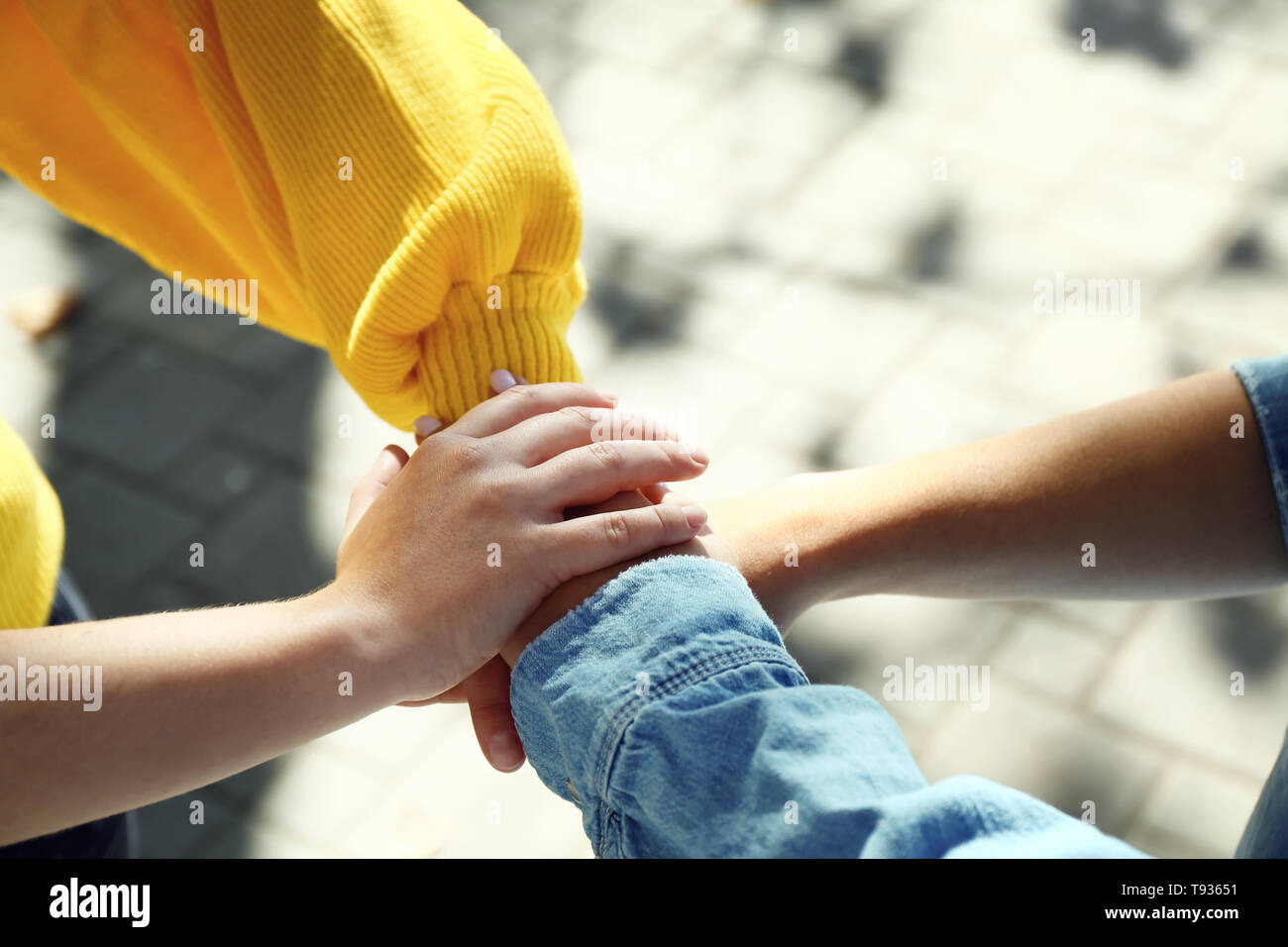 People putting hands together outdoors. Unity concept Stock Photo - Alamy