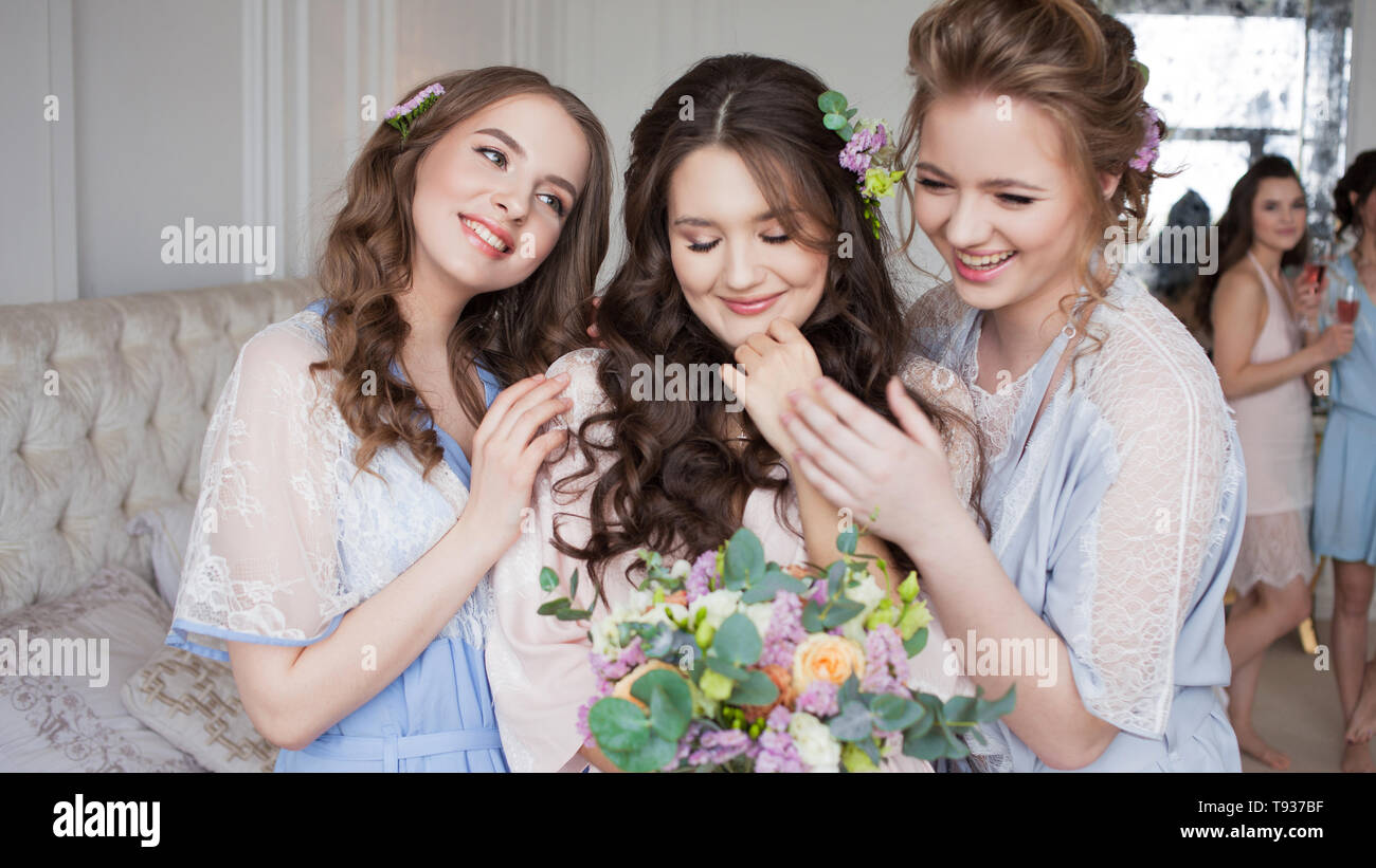 Girlfriends hug bride, bachelorette party. Beautiful young women in ...