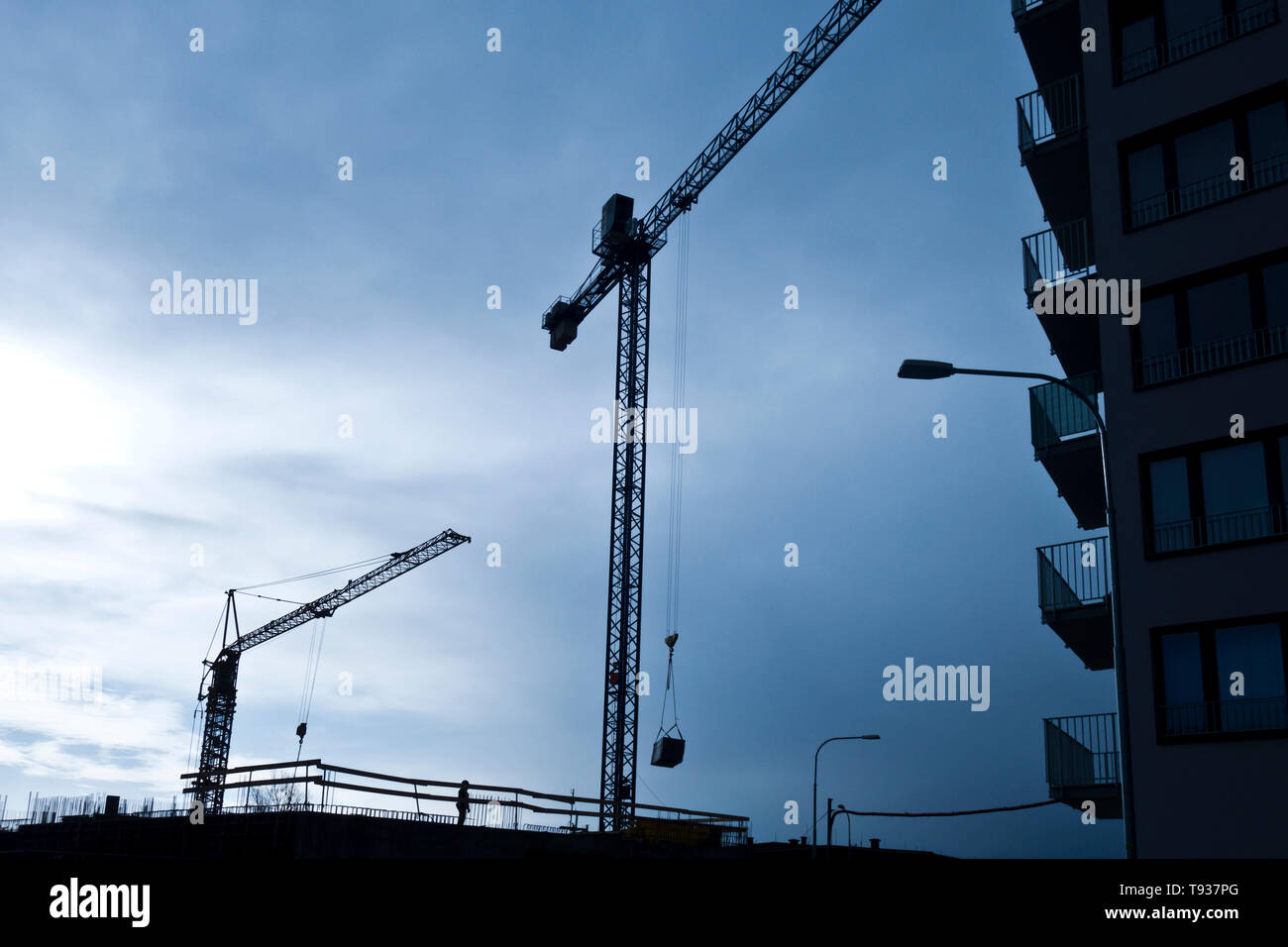 two construction towers at a construction site Stock Photo - Alamy