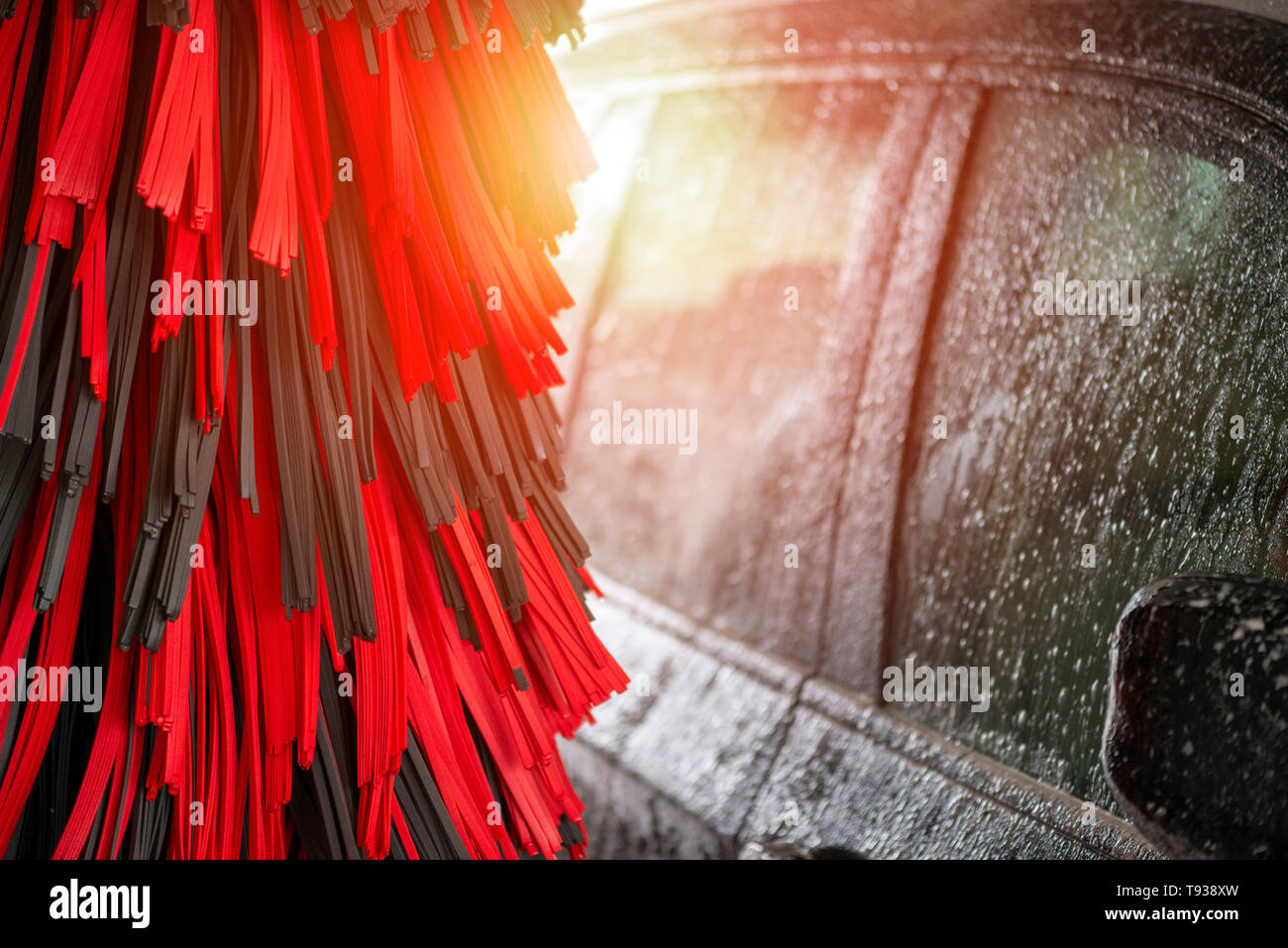 Automatic car wash in action. Car wash concept. Automated technology ...