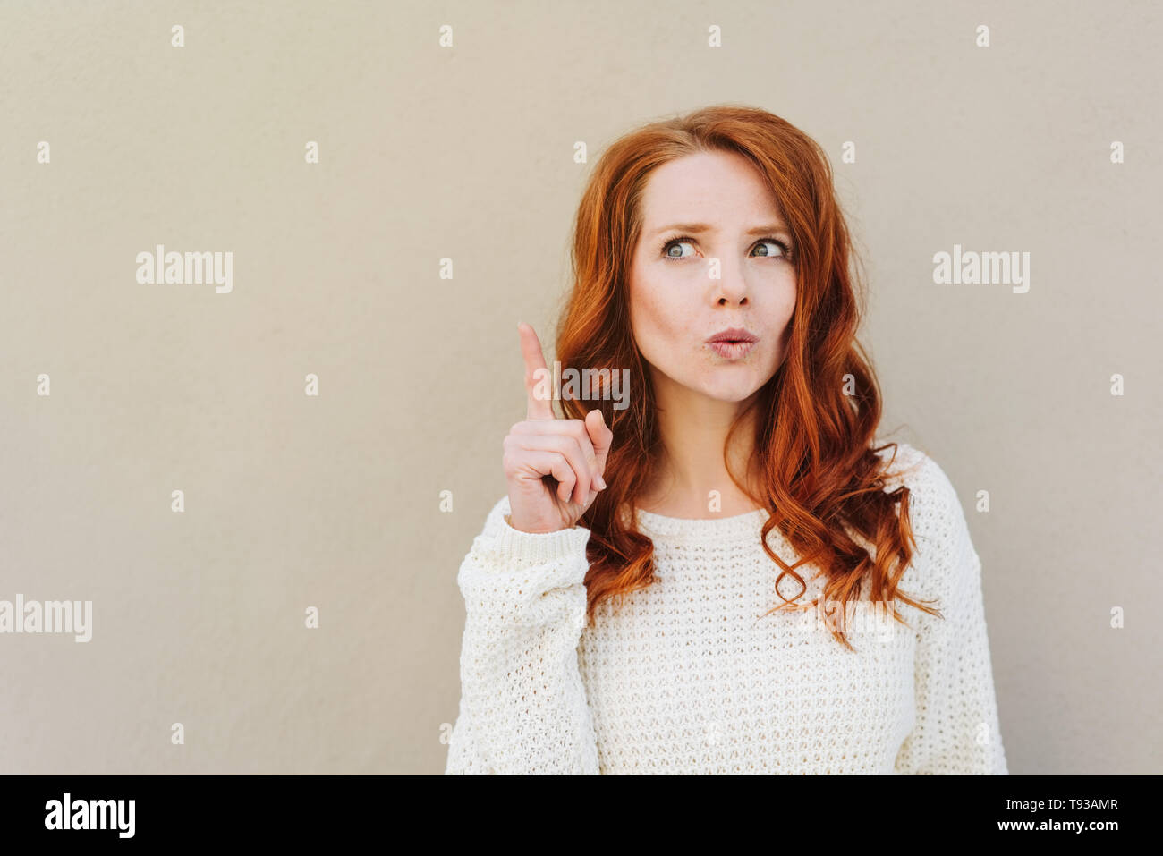 Woman raising finger hi-res stock photography and images - Alamy