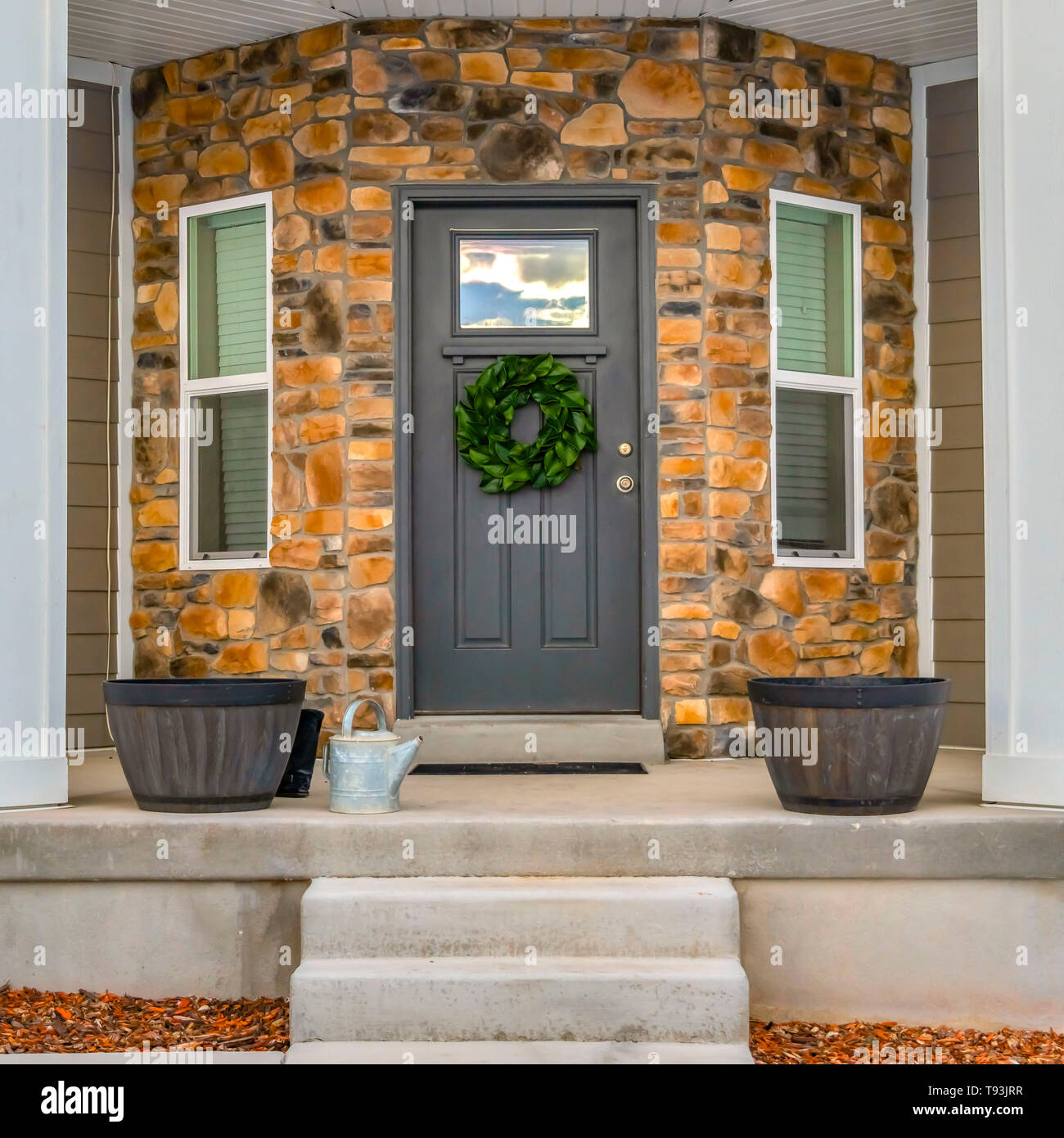 Square Glass paned front door and windows on the half hexagon shaped ...