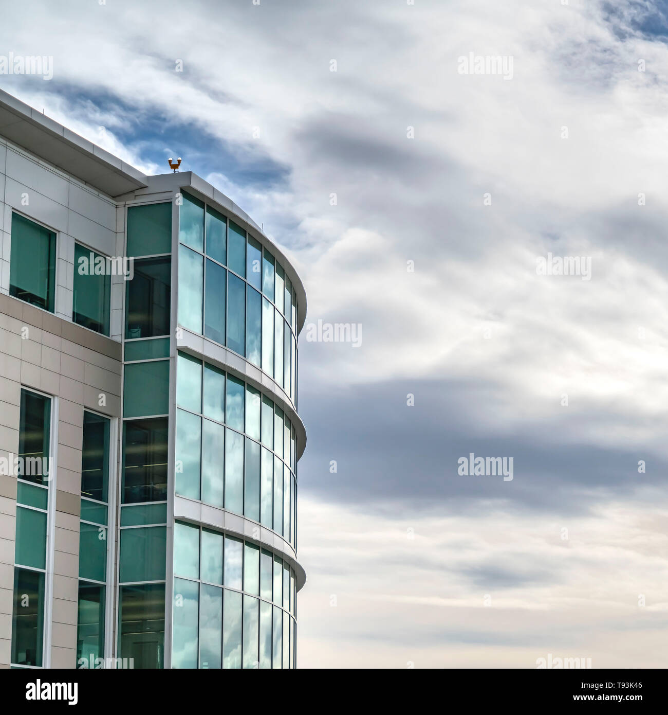 Square Exterior of a modern building with shiny and reflective glass ...
