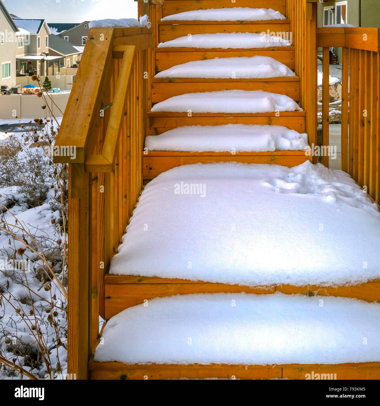 Clear Square Outdoor wooden staircase of a home covered with snow ...