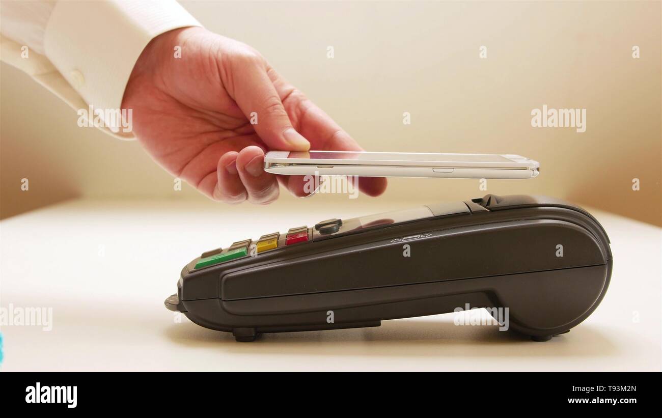 Man using smartphone express pay hi-res stock photography and images ...