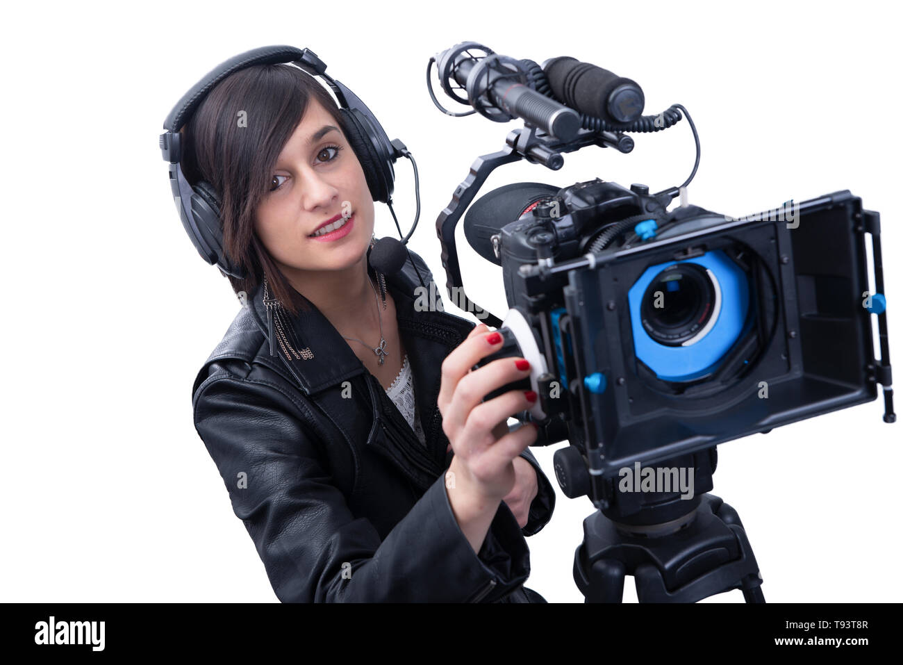 young woman with professional video camera, DSLR, isolated on white ...