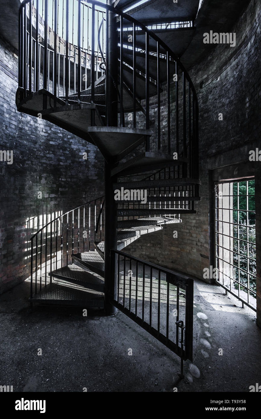 A spiral metal staircase in a secret garden in Hampstead, London Stock ...