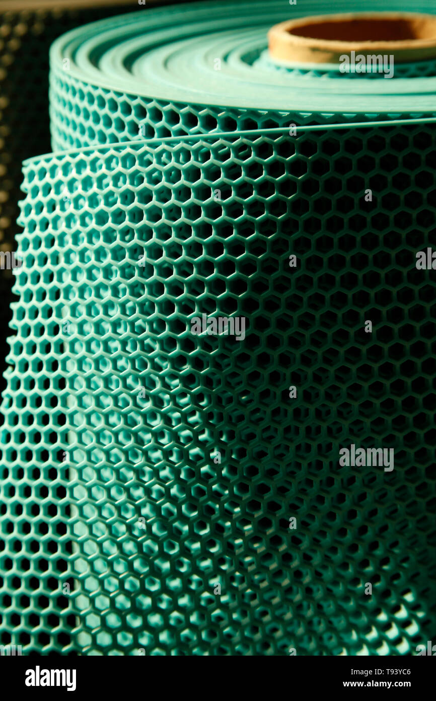 Colorful and perforated plastic grid Stock Photo - Alamy