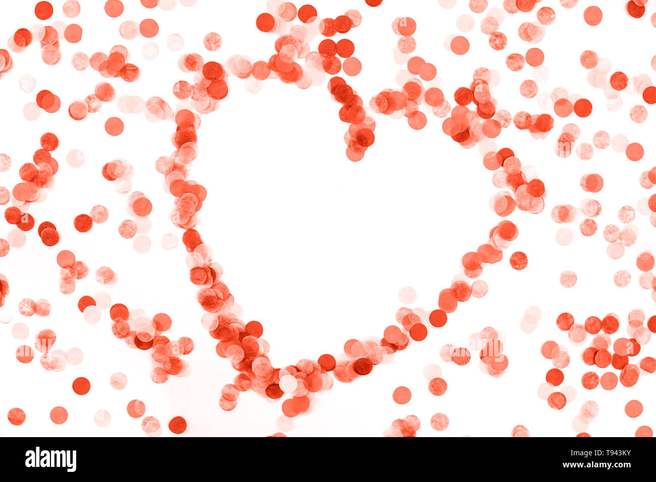 Bright coral confetti isolated on white background Stock Photo - Alamy