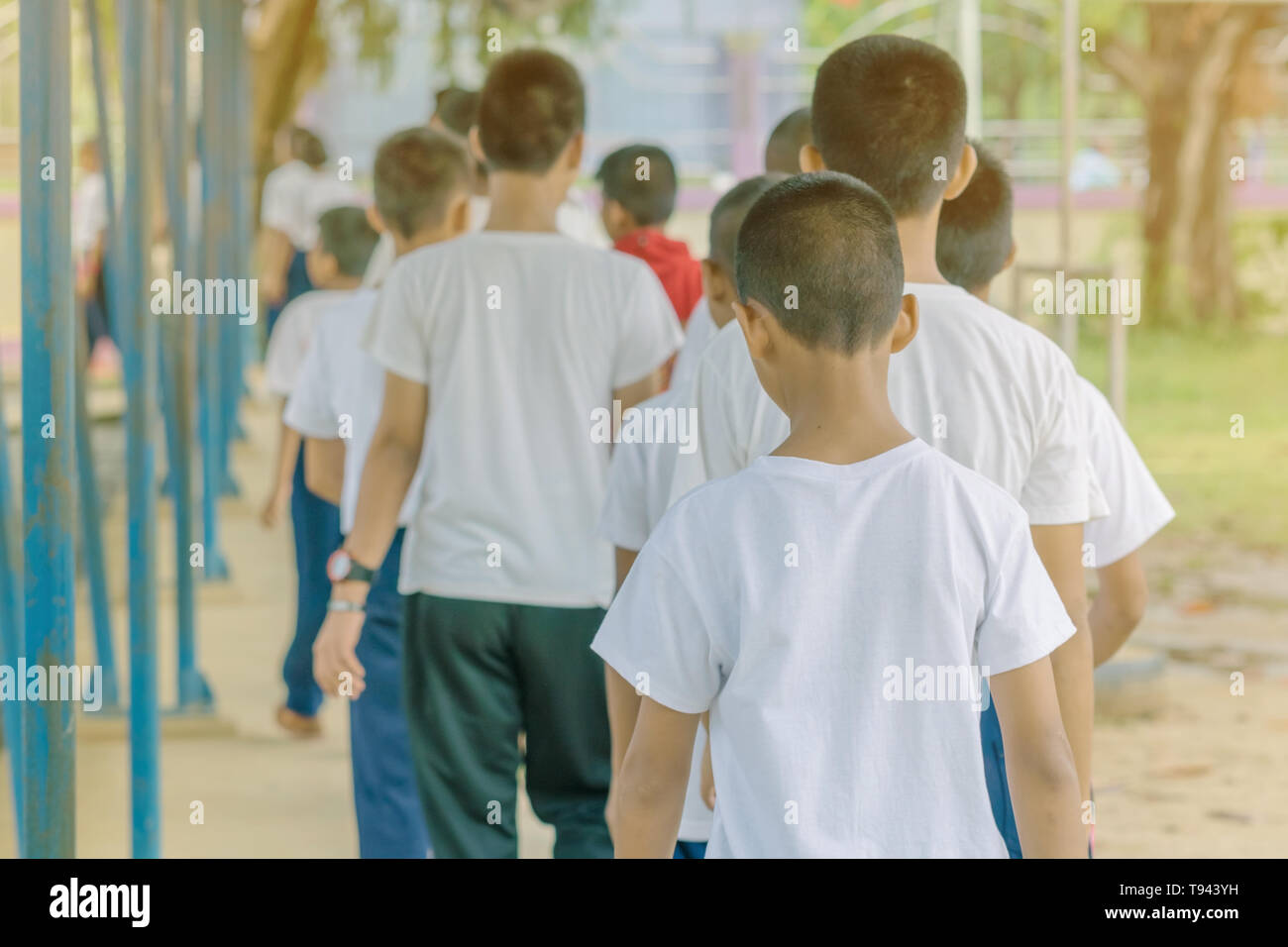 Group of students try to meditate for the peace of mind by walk with ...