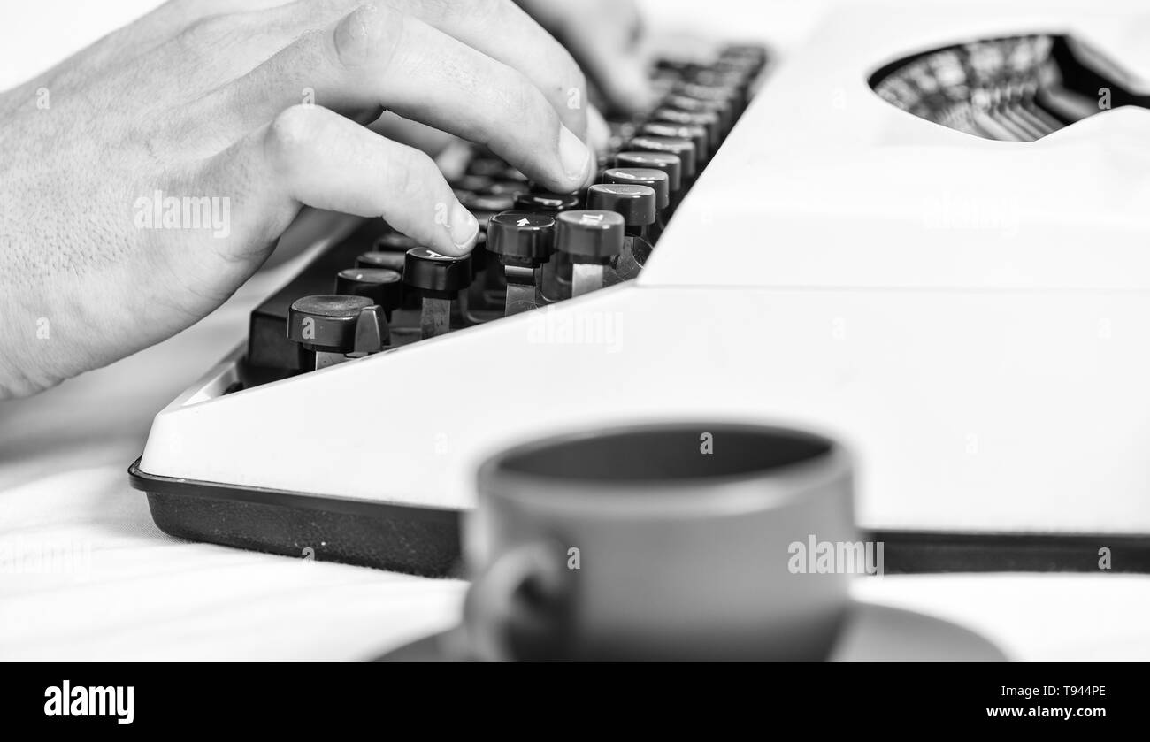 Old typewriter and authors hands. Male hands type story or report using ...