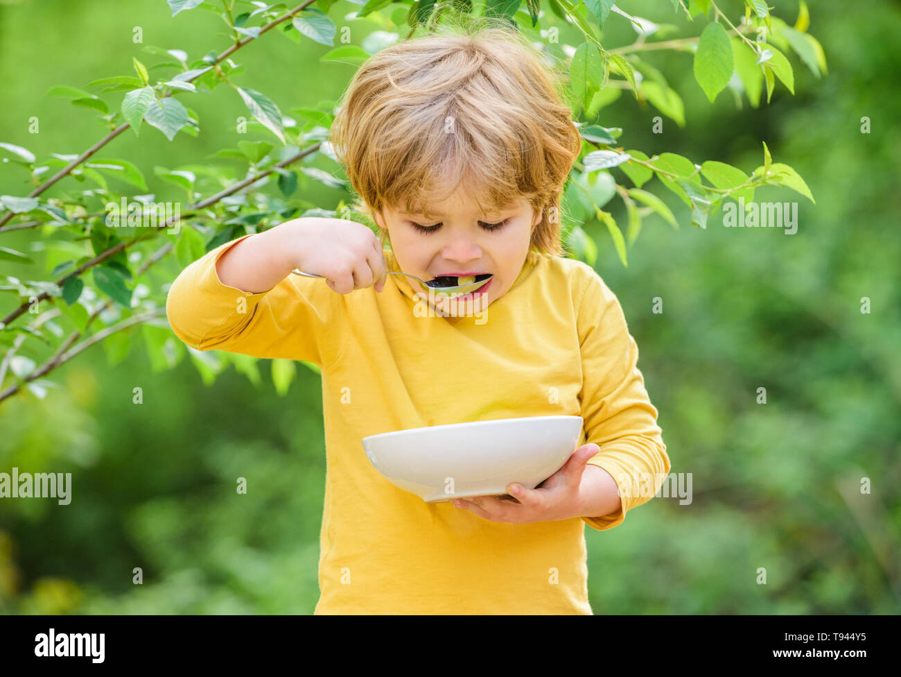 Small child enjoy homemade meal. Nutrition for kids. Little toddler boy ...