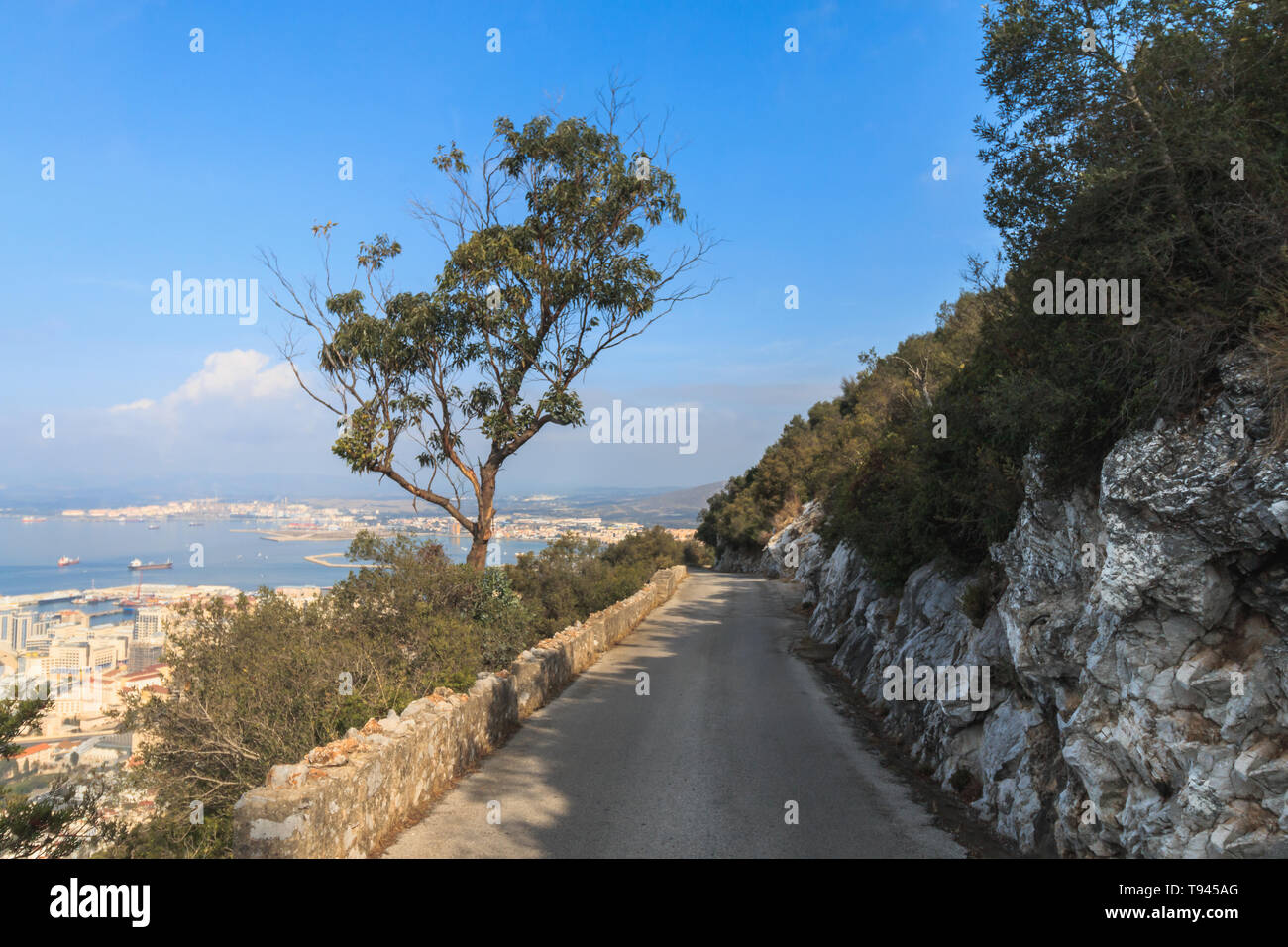 Road downhill on the edge of The Rock cliff, Gibraltar summer season ...