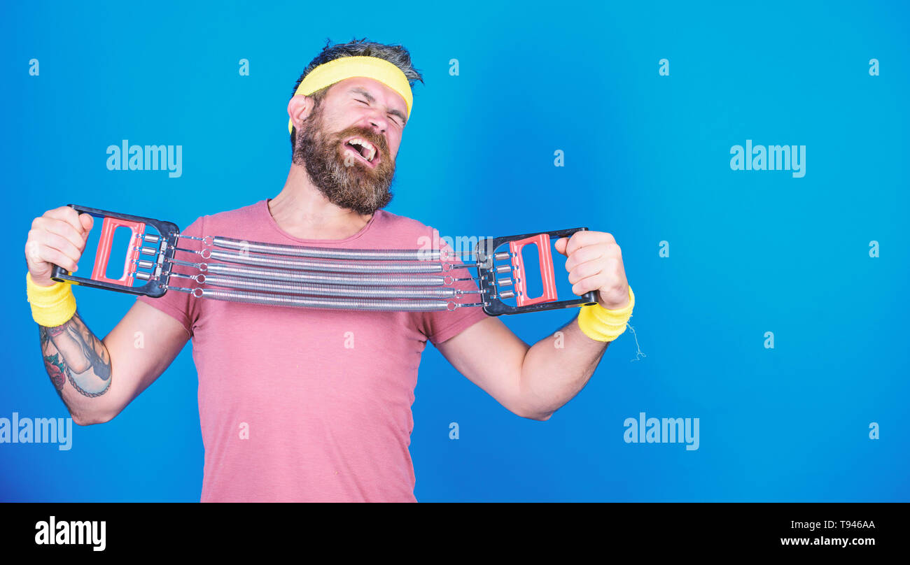 Athlete workout with expander. Improve your muscles with sport ...
