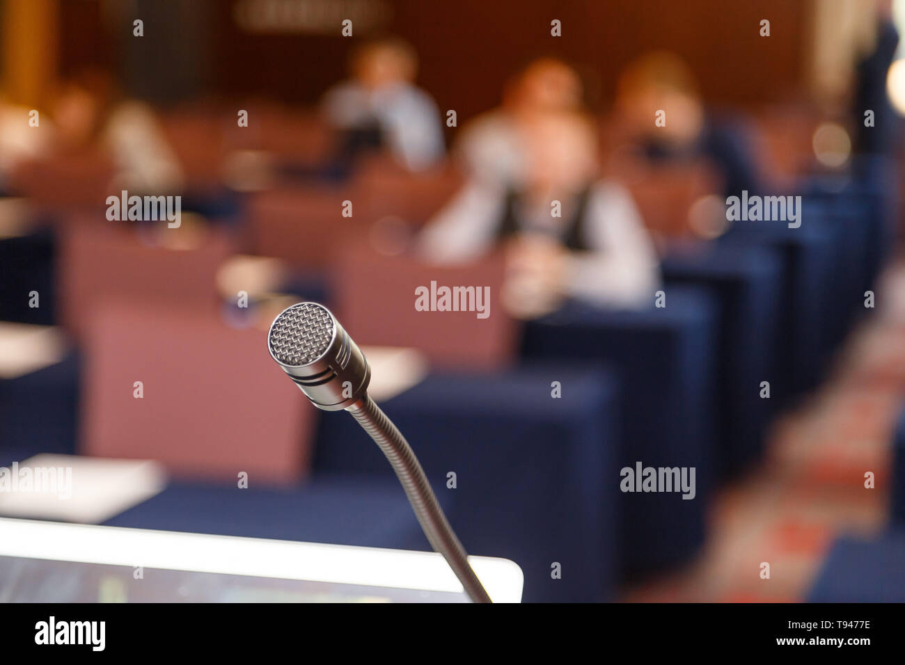 Microphone over conference hall background, Business meeting concept ...