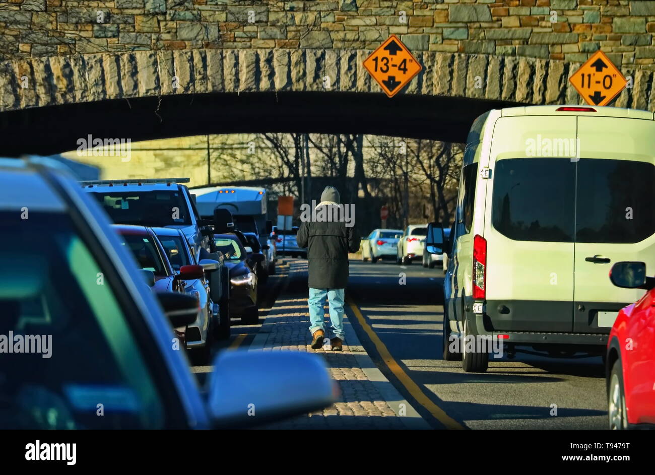 Homeless man walking in between cars asking for donations Stock Photo ...