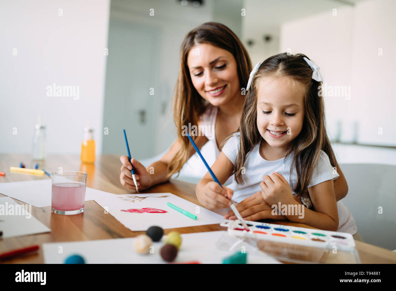 Happy family having fun time at home Stock Photo - Alamy