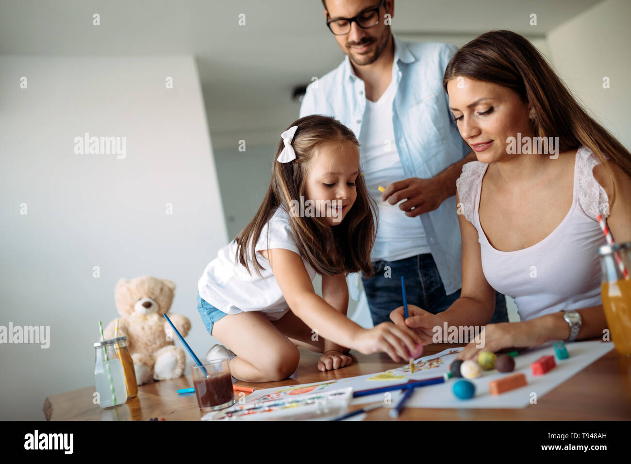 Happy family having fun time at home Stock Photo - Alamy