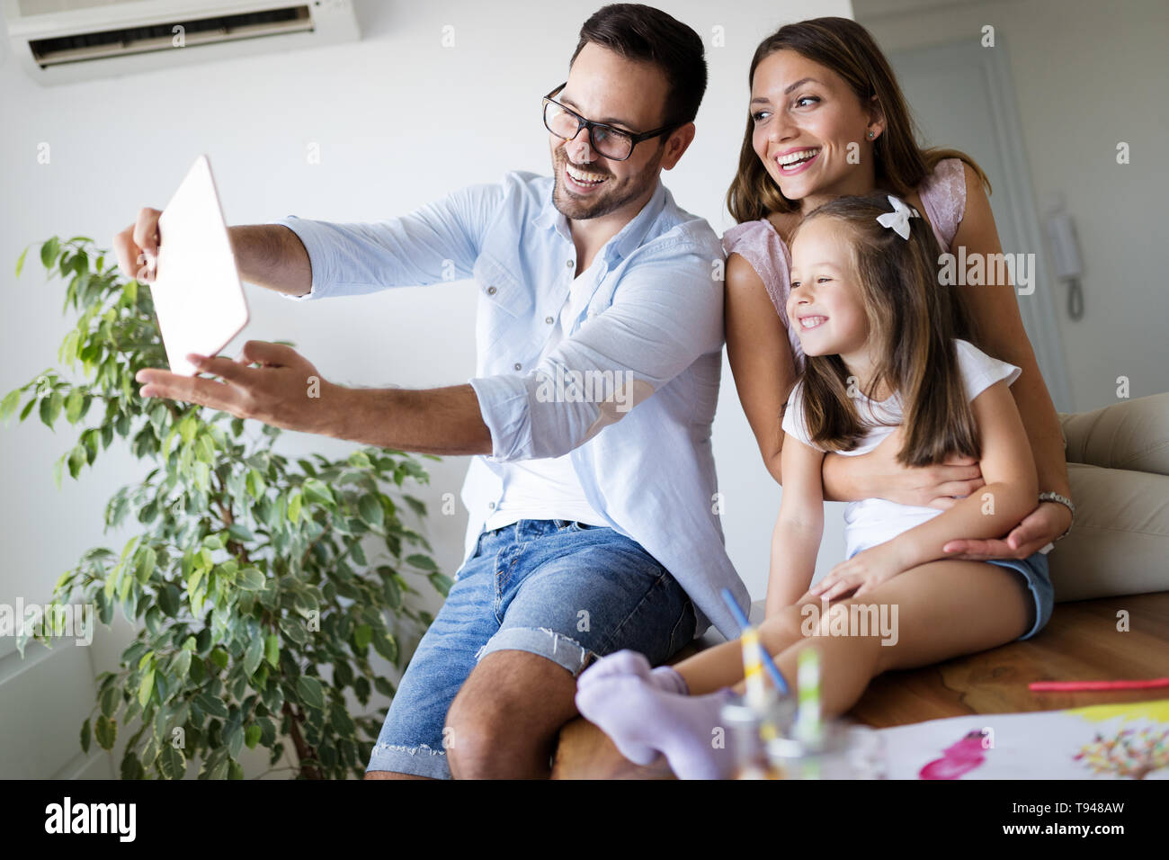 Happy family having fun time at home Stock Photo - Alamy