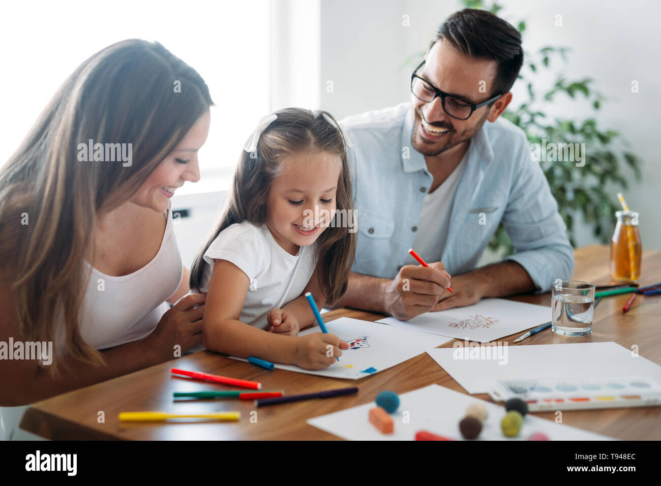 Happy family having fun time at home Stock Photo - Alamy