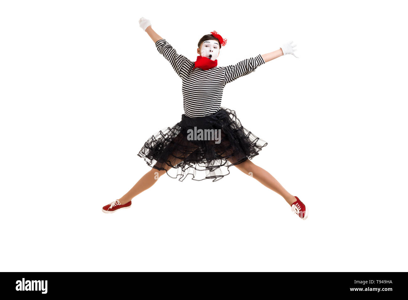 Full length portrait of mime woman artist jumping isolated on white ...