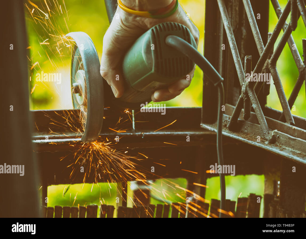 Worker using grinder machine cutting hi-res stock photography and ...
