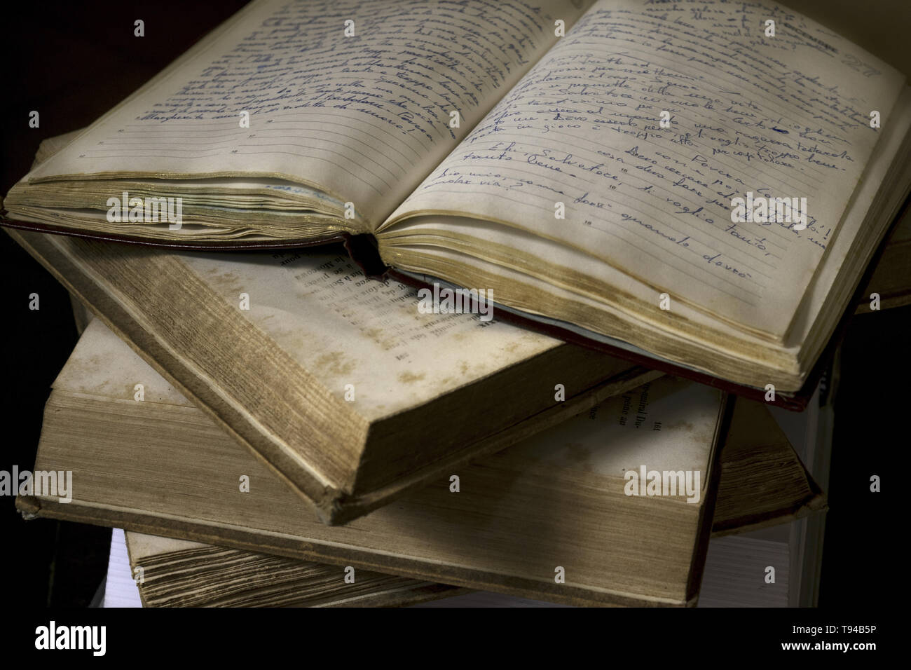 stack of old books with a handwritten diary Stock Photo - Alamy