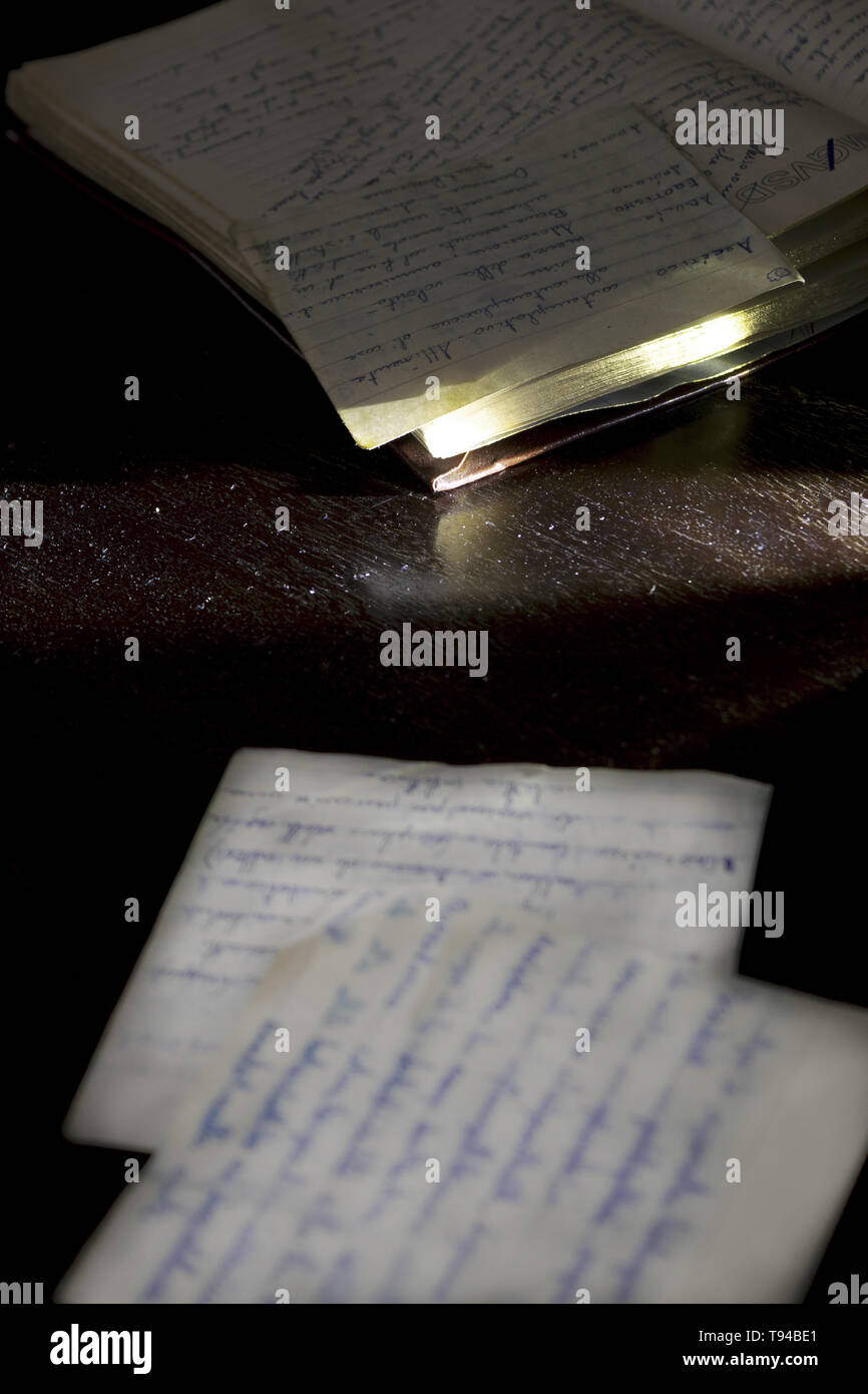 old handwritten letter illumined from lateral light Stock Photo - Alamy