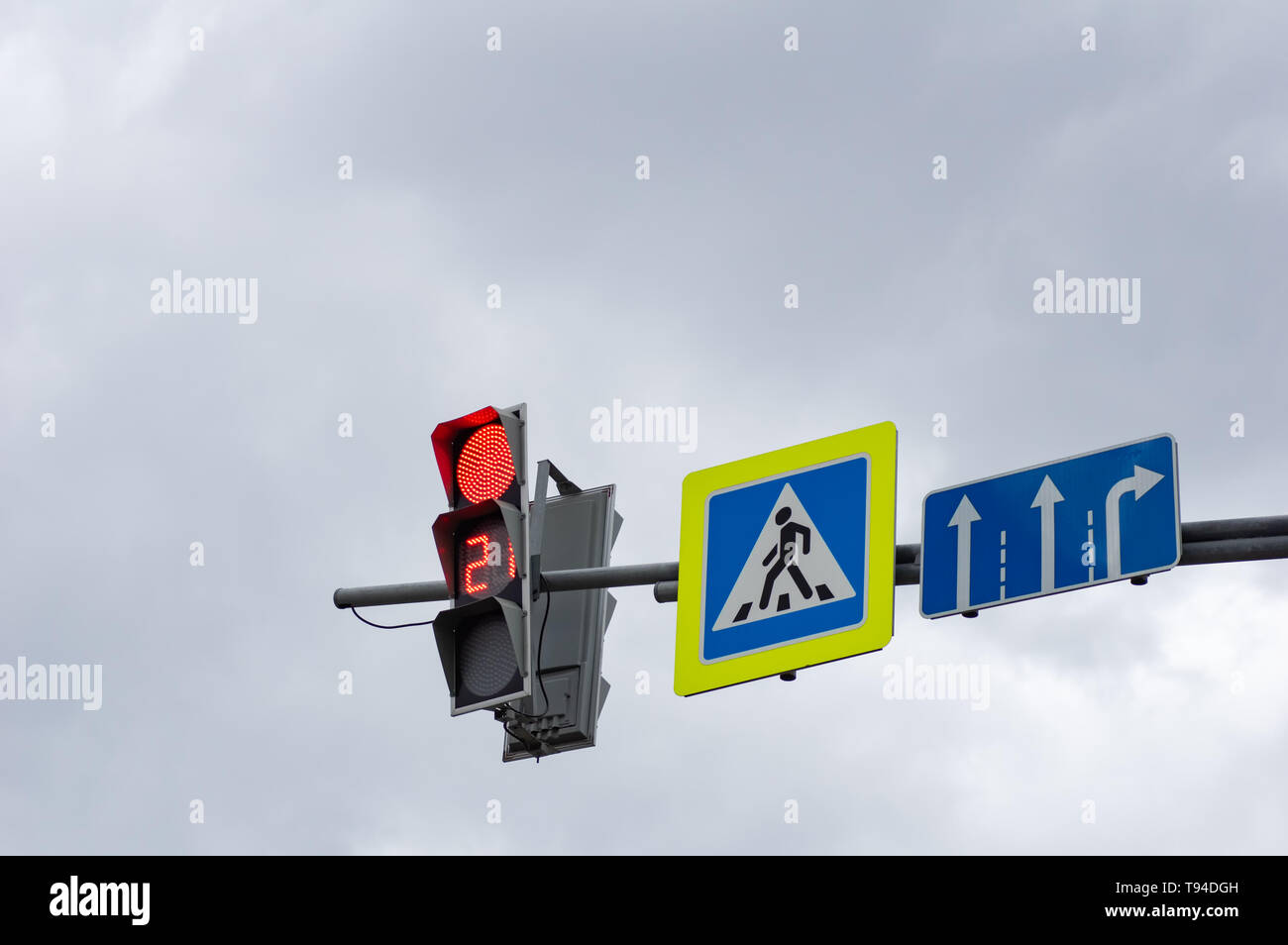 Red color at the traffic lights. Sign of the pedestrian crossing. Road ...